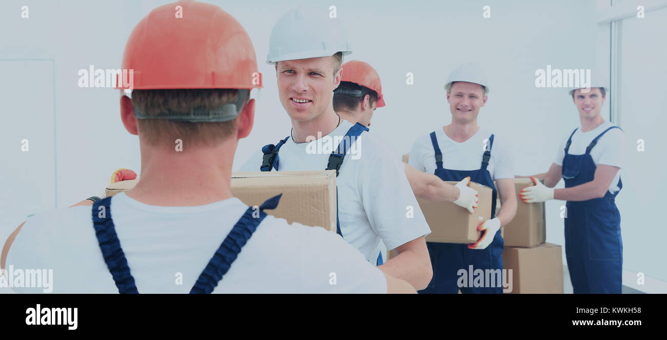 workers unload boxes Stock Photo - Alamy