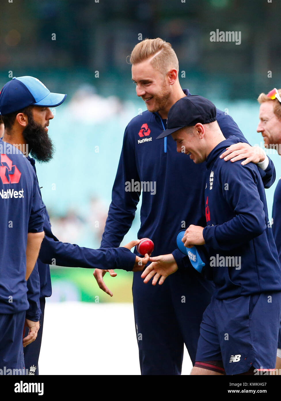 England's Mason Crane is congratulated by Moeen Ali and Stuart Broad on ...