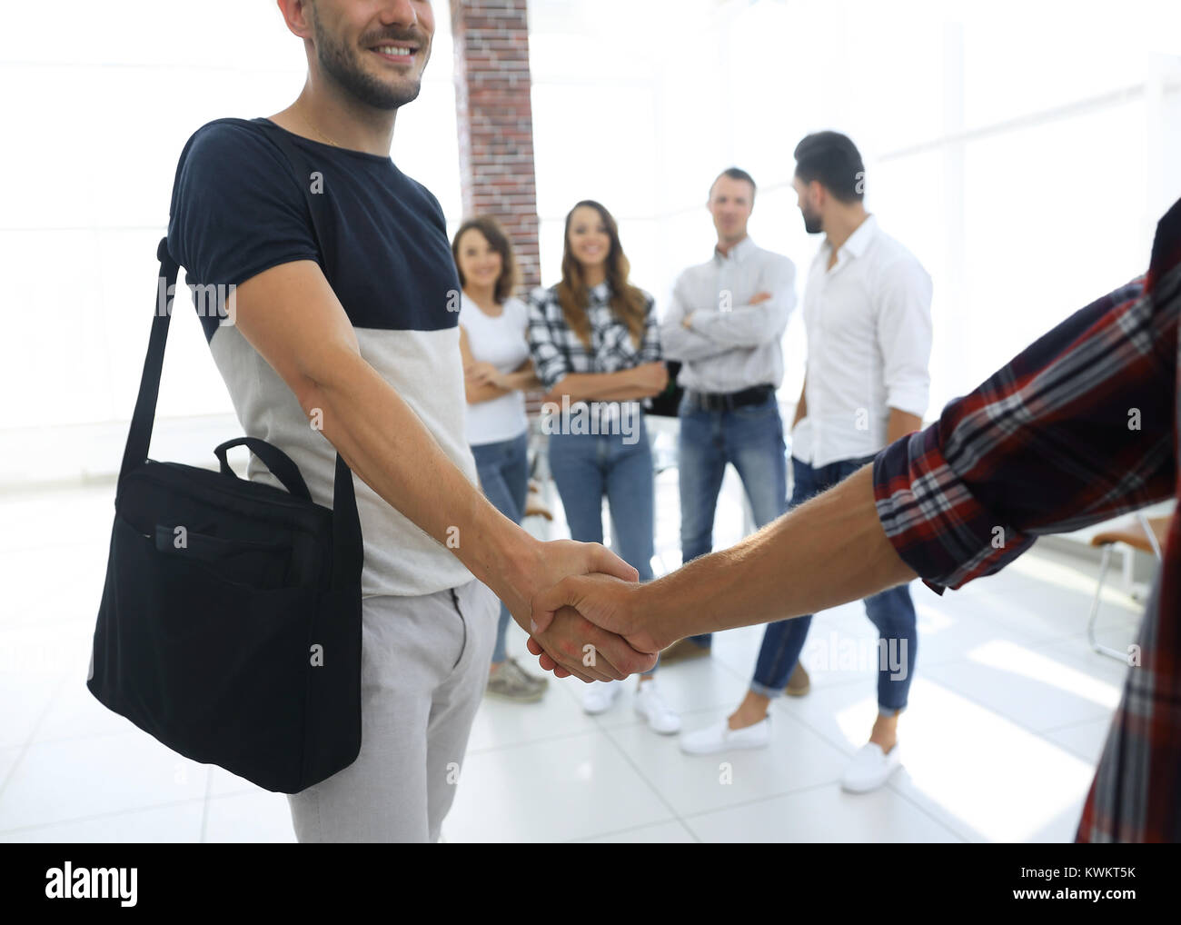 handshake between the designer and the client Stock Photo - Alamy