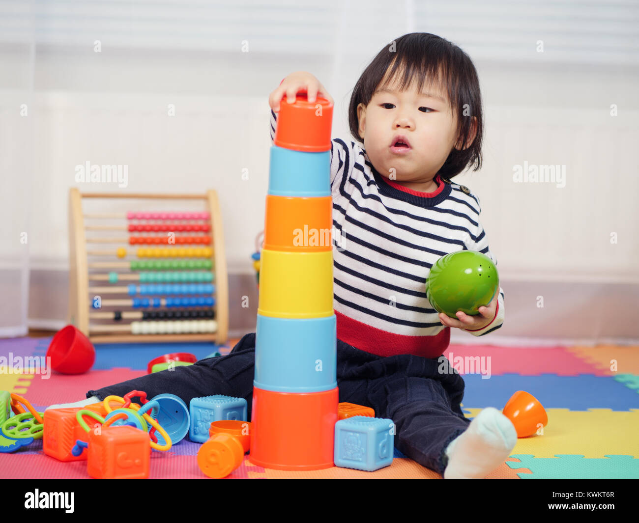 baby girl play toy at home Stock Photo - Alamy