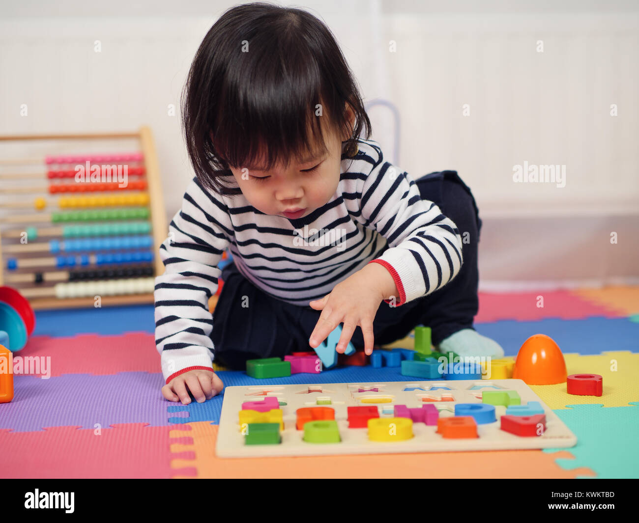 baby girl learning alphabet at home Stock Photo - Alamy