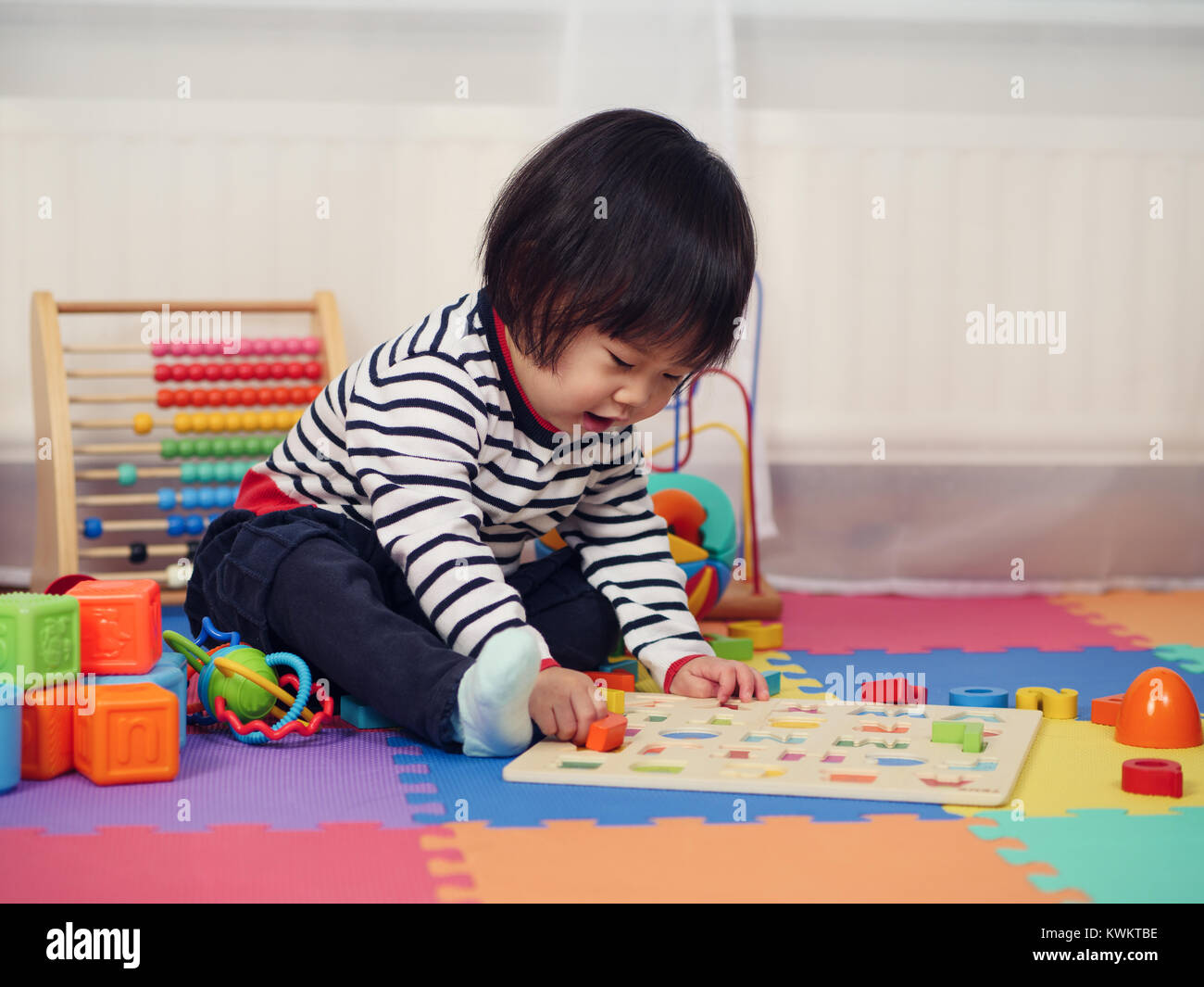 baby girl learning alphabet at home Stock Photo - Alamy