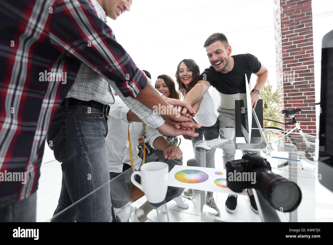 Team meeting are stacked hands in creative office Stock Photo - Alamy