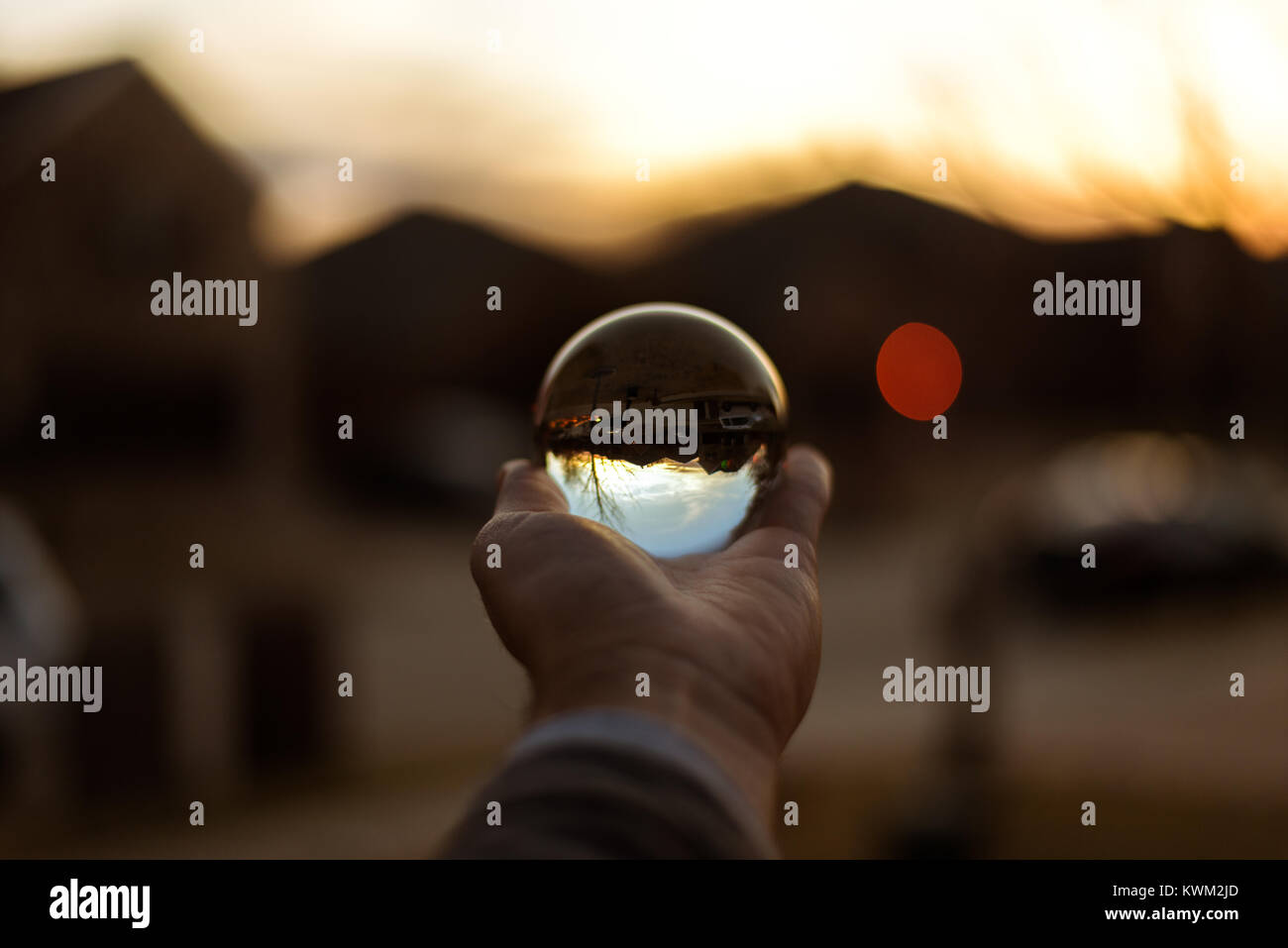 Lens ball in hand Stock Photo - Alamy