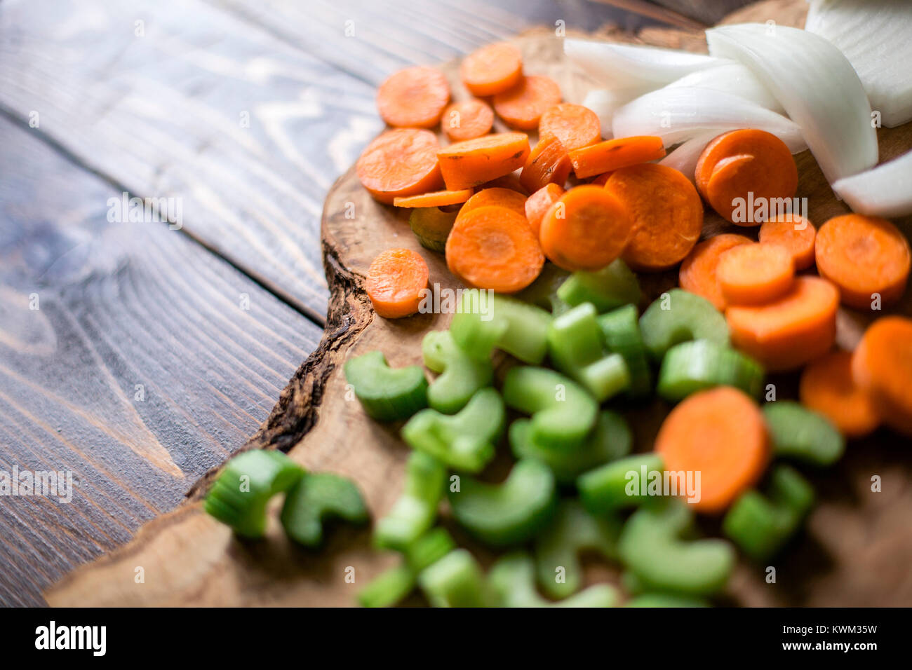 Close-up of chopped vegetables on wood at table Stock Photo - Alamy