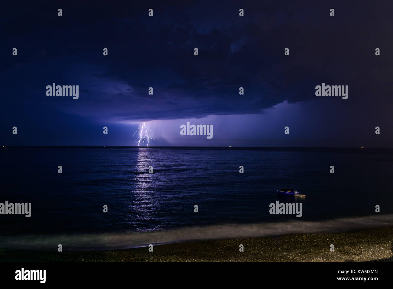 Lightning during a night thunderstorm on the summer ligurian sea Stock ...