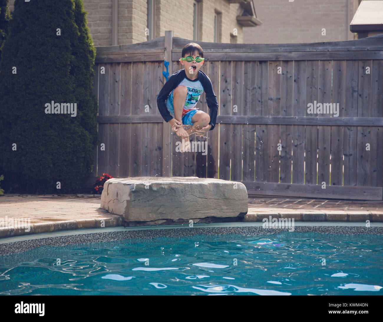 Jumping into pool male hi-res stock photography and images - Alamy