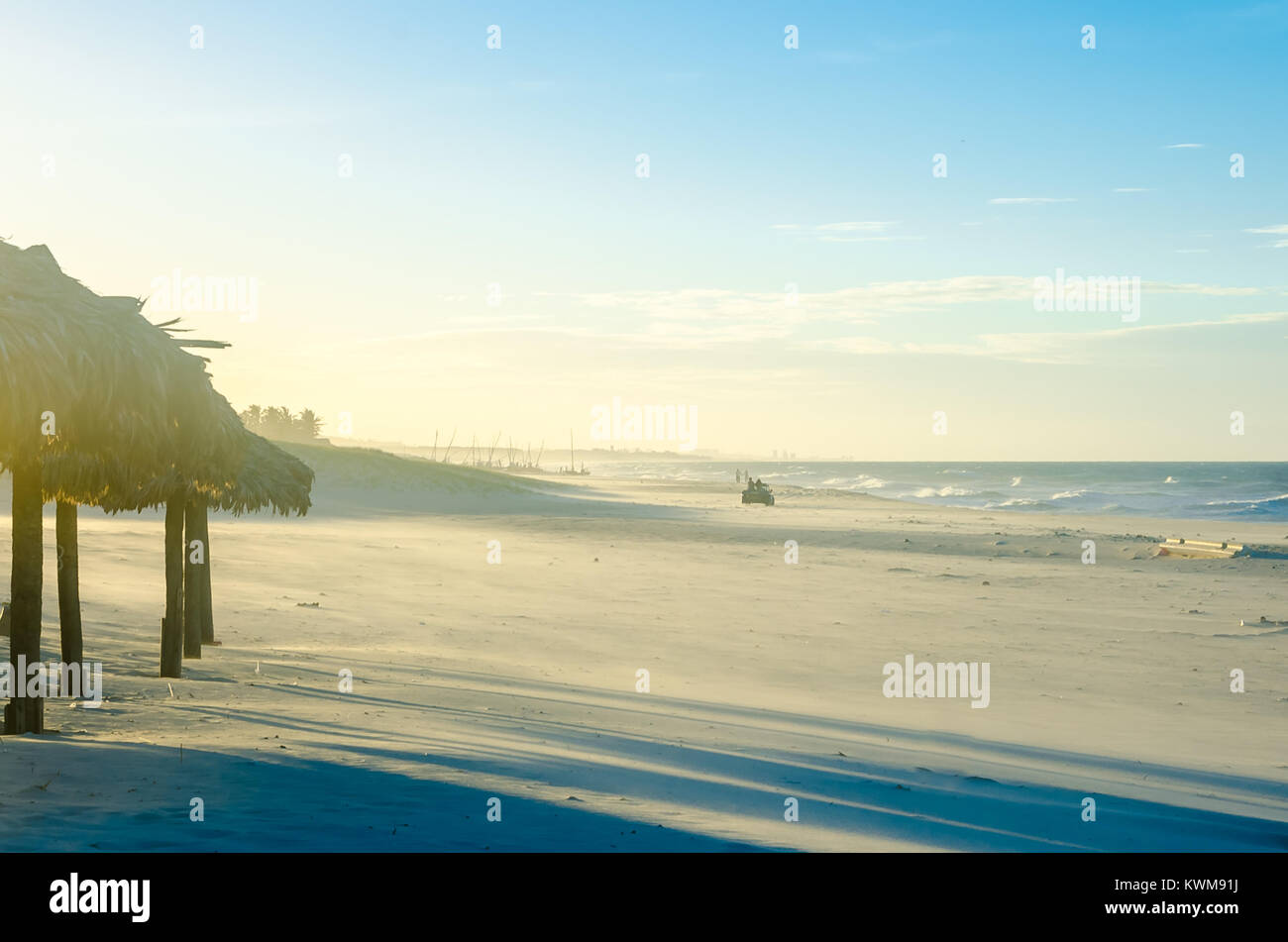 Buggy on the beach at the sunset with people around Stock Photo - Alamy