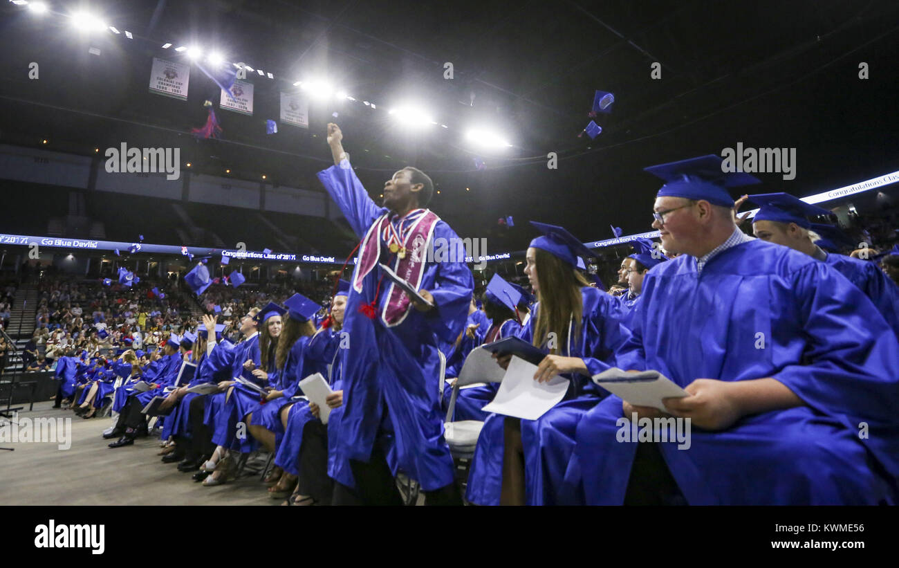 Moline, Iowa, USA. 4th June, 2017. Graduates throw their caps into the ...