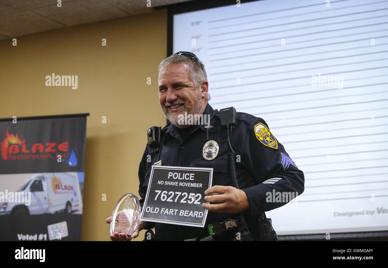 Moline, Iowa, USA. 30th Nov, 2017. Moline Police Sgt. Kevin Cox holds ...