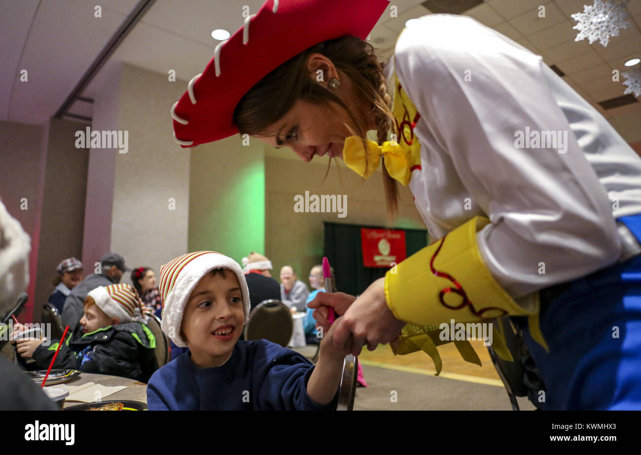 Moline, Iowa, USA. 6th Dec, 2017. Robin Dixon of Reynolds, dressed as ...