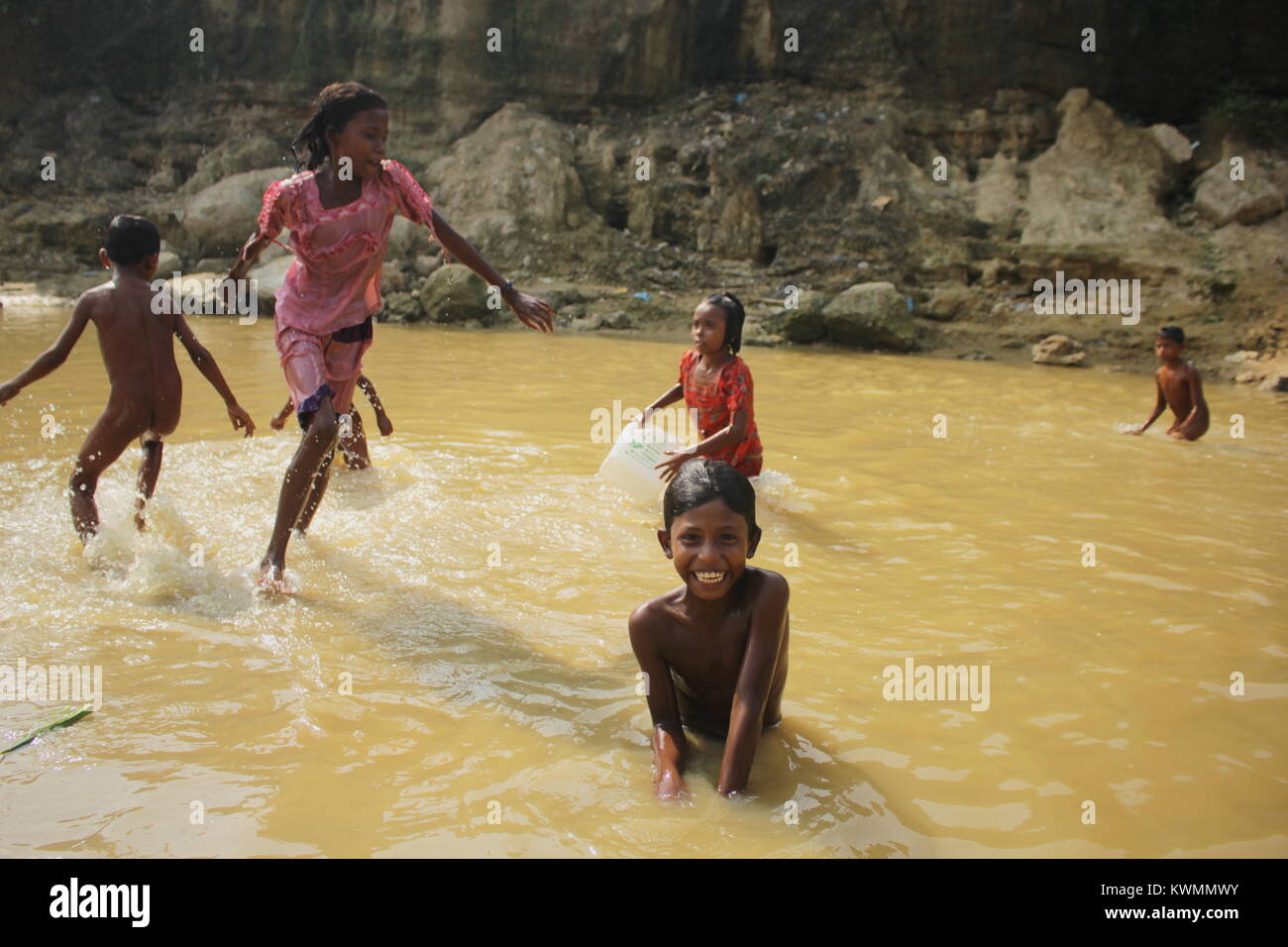Children playing in dirty water hi-res stock photography and images - Alamy