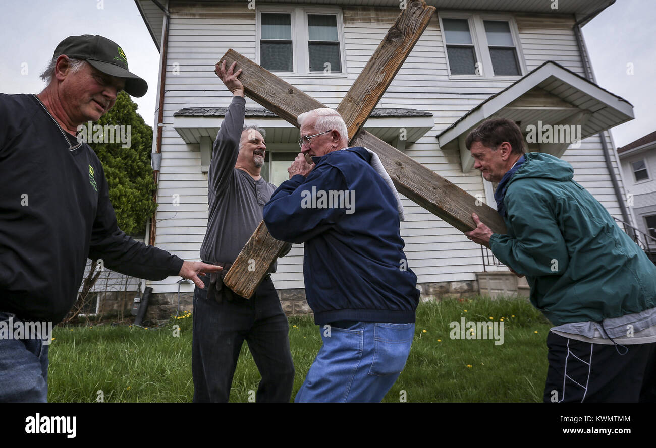 Rock Island, Iowa, USA. 14th Apr, 2017. Pastor Drew Nagle, center rear ...