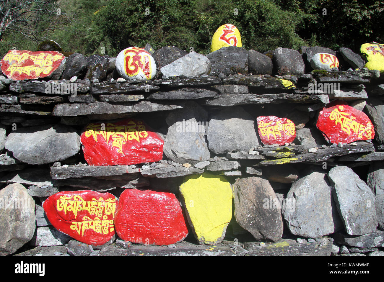 Sacred stones in the buddhist village in Nepal Stock Photo - Alamy