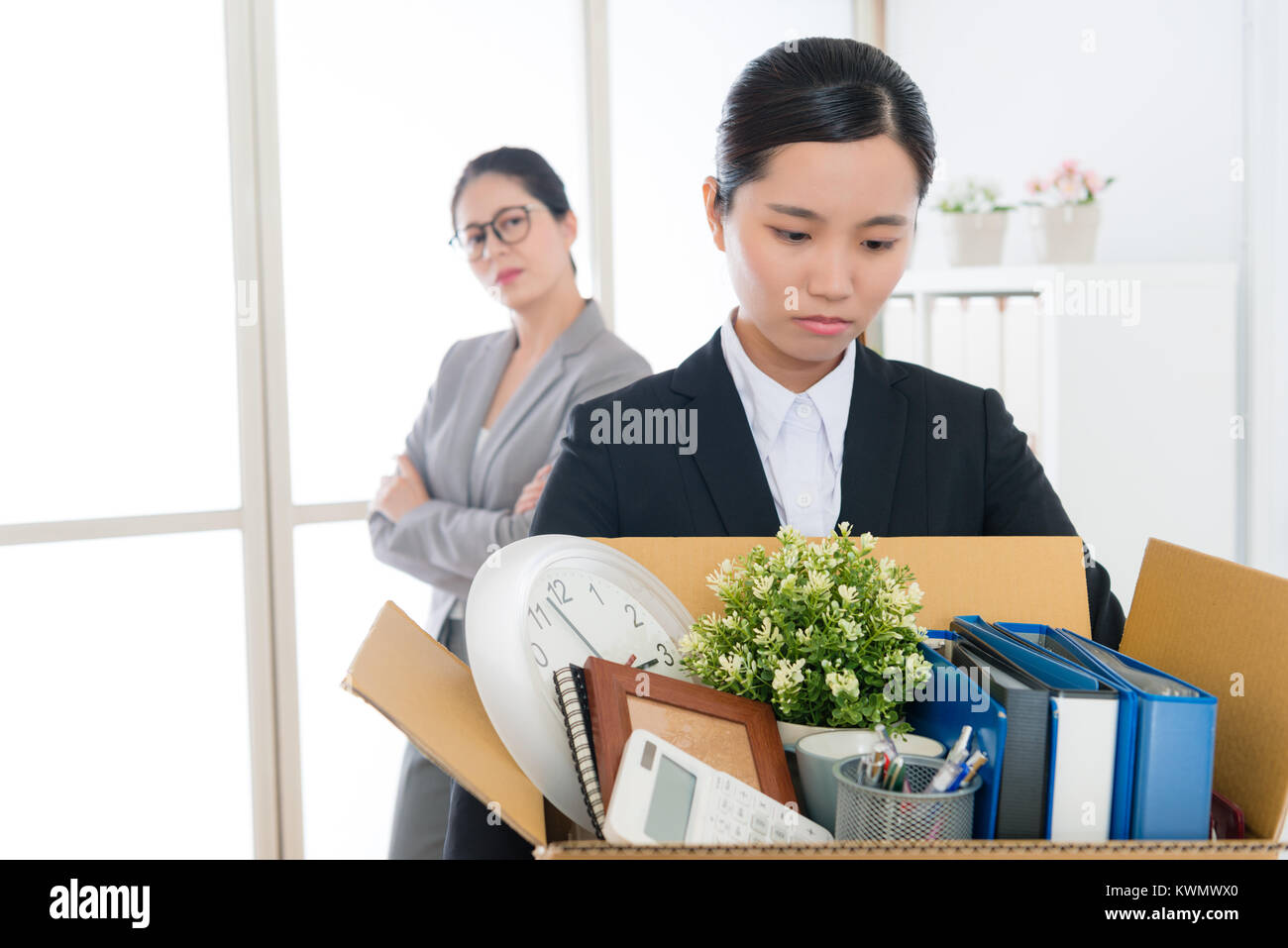 sad pretty office worker girl losing company job packing personal items ...