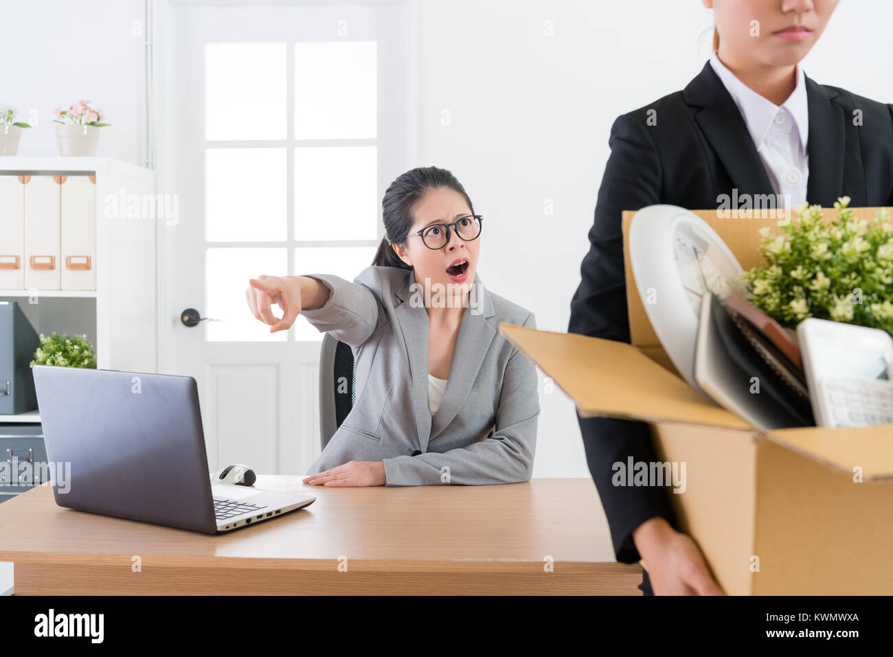 pretty attractive business manager shouting blame employee girl and ...