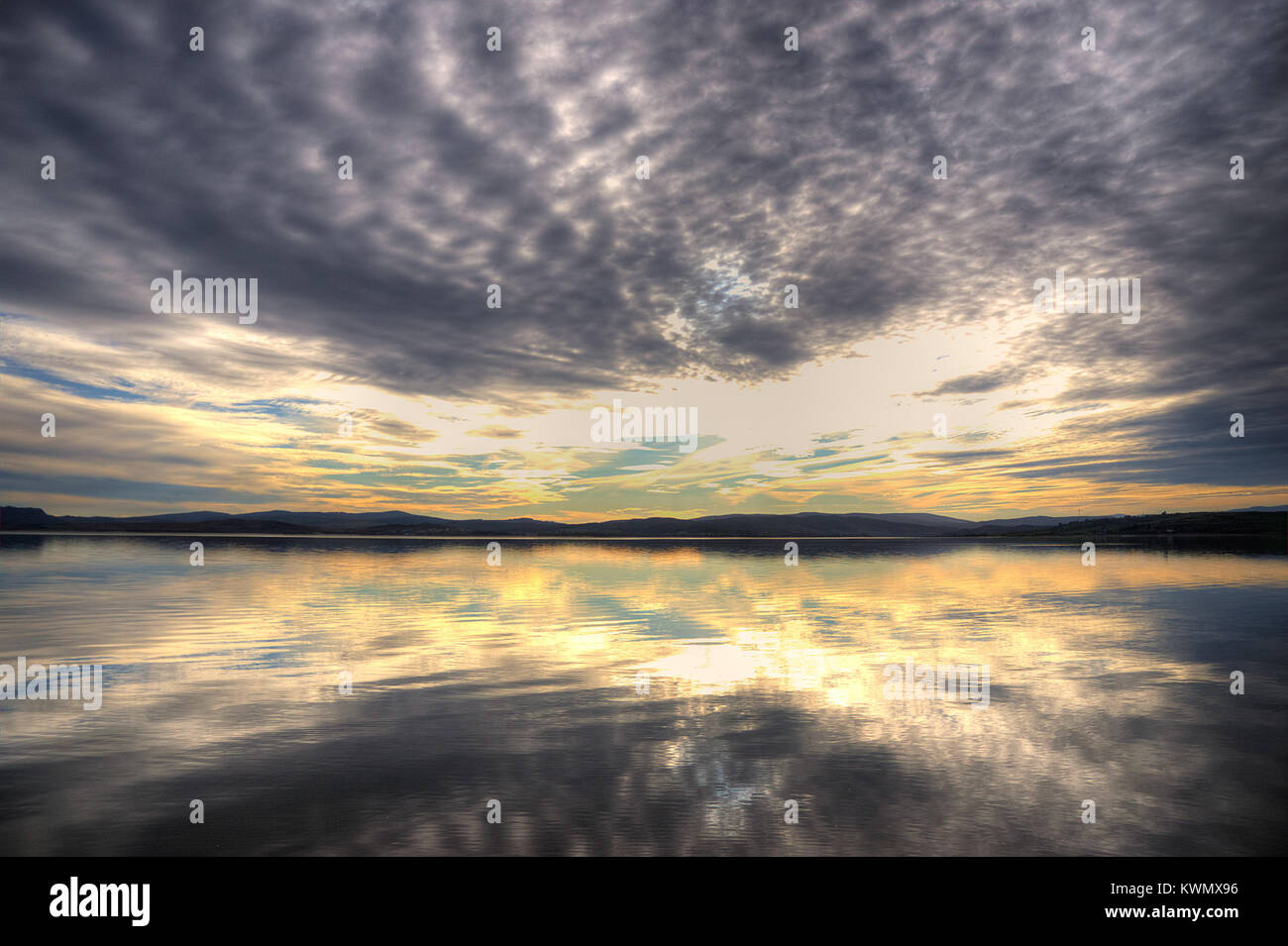 Clouds reflection on a natural reservoir Stock Photo - Alamy