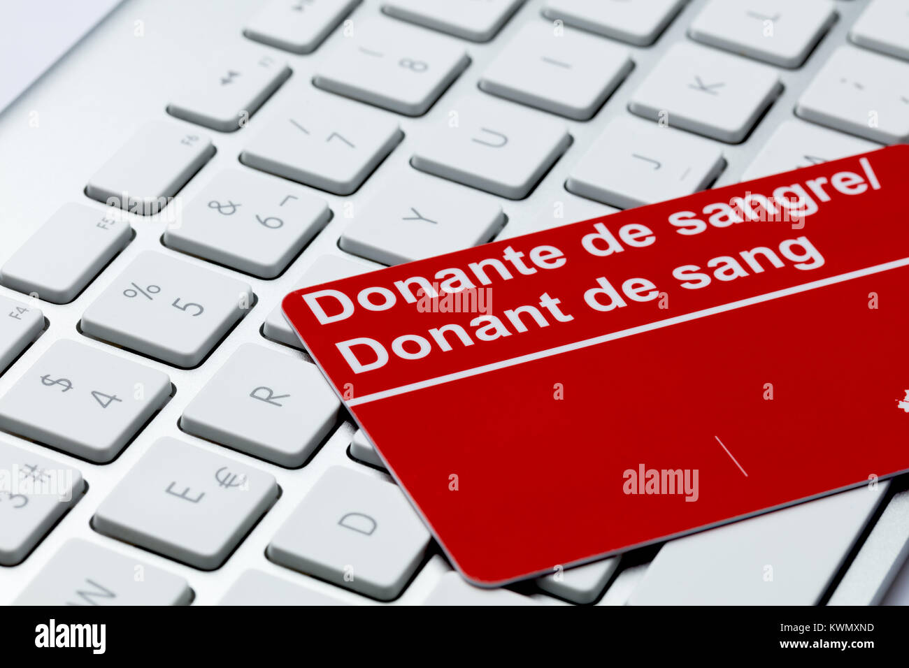 blood donor card color red on keyboard laptop Stock Photo - Alamy