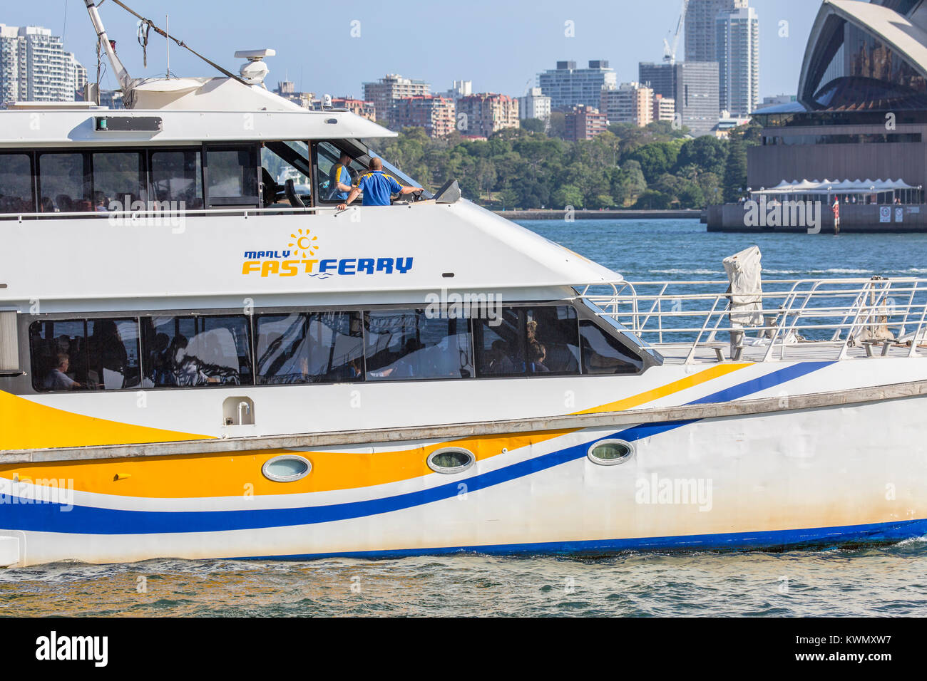 Manly fast ferry vessel travelling on Sydney harbour with Sydney opera ...