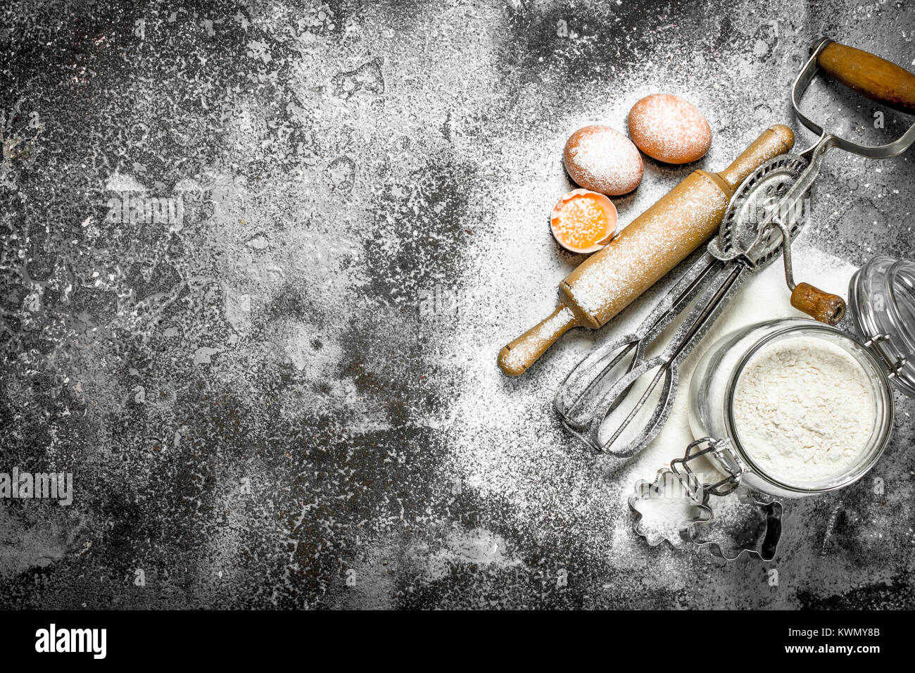 Baking background. Ingredients and tools for dough preparation. On a ...