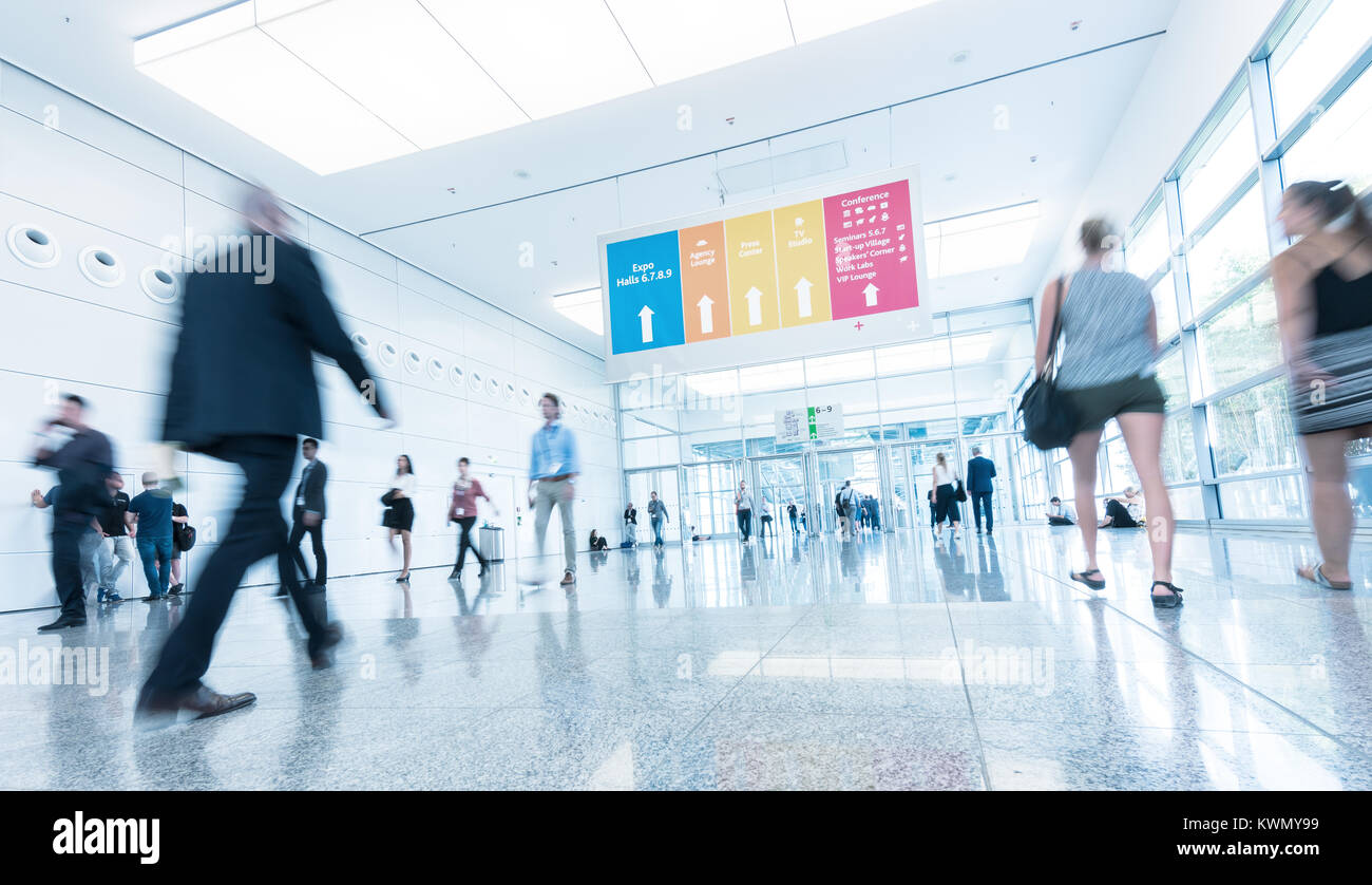 Blurred business people at a trade show Stock Photo - Alamy