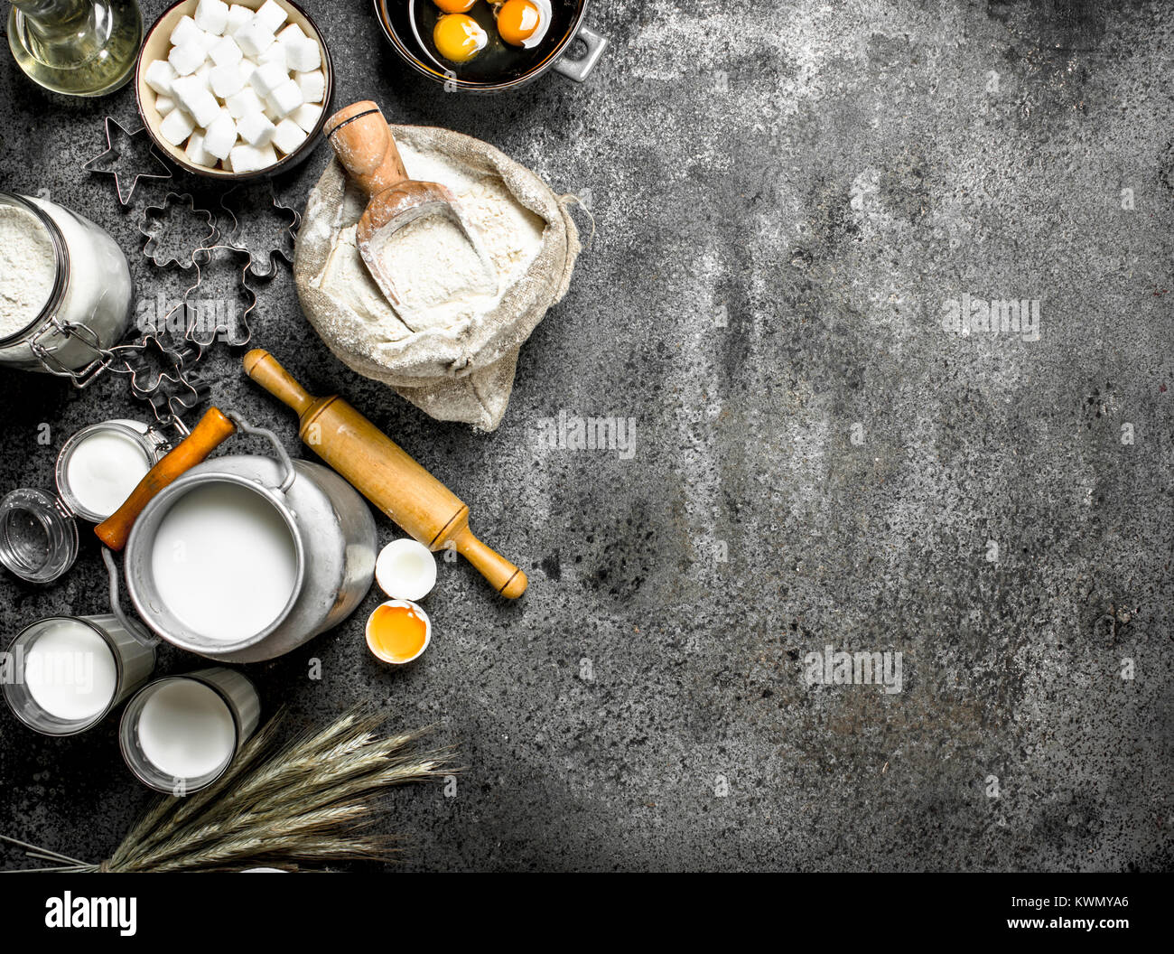 Baking background. Milk, flour and other ingredients for the dough. On ...