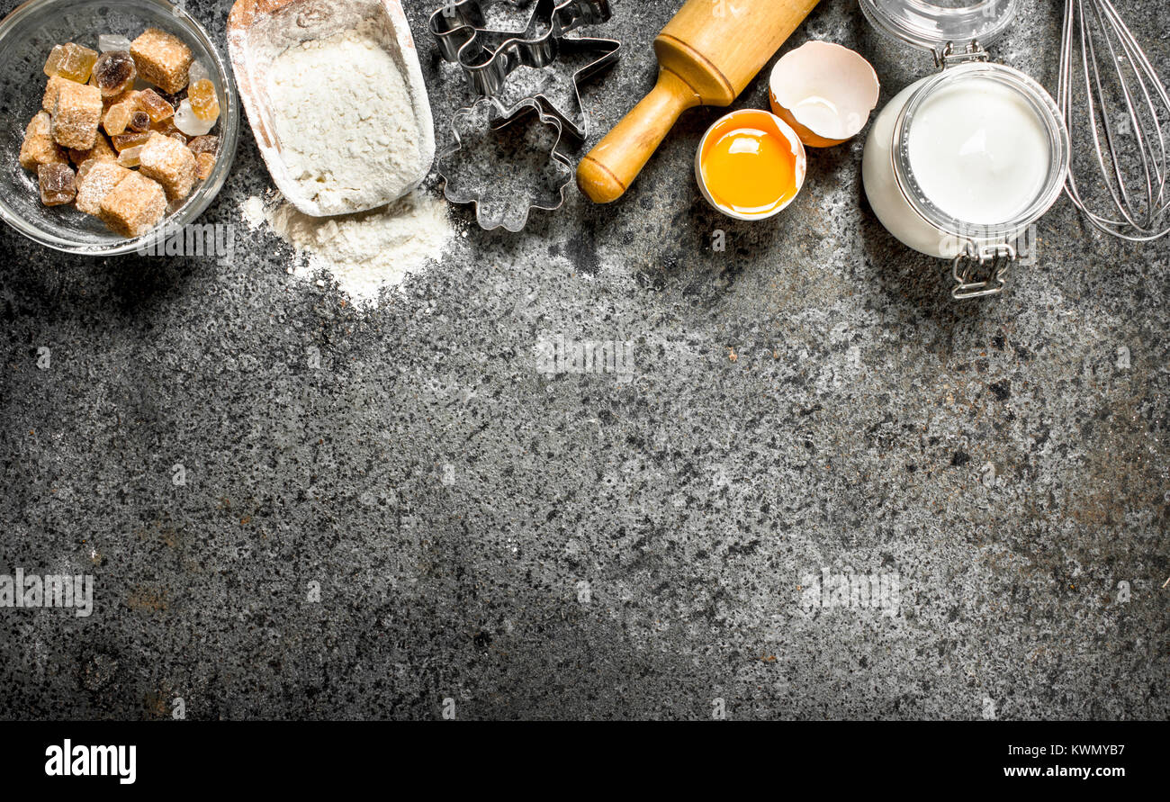 Baking background. Fresh ingredients for dough. On a rustic background ...