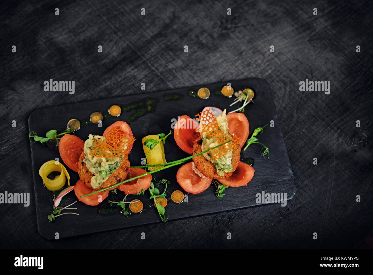 Seafood snacks with tomatoes Stock Photo - Alamy