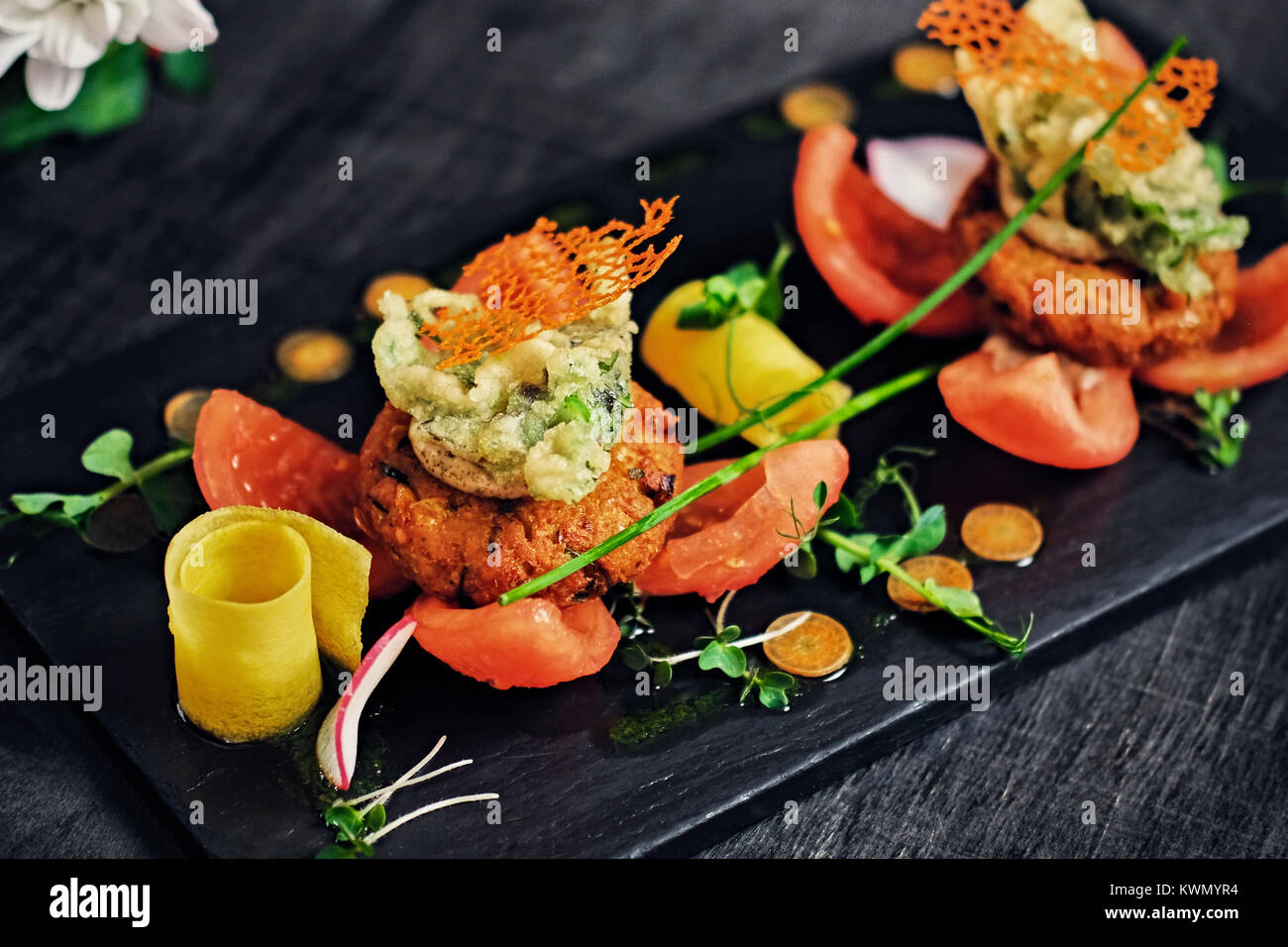 Seafood snacks with tomatoes Stock Photo - Alamy