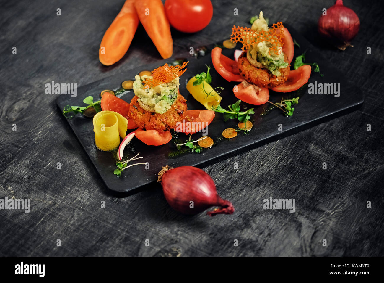 Seafood snacks with tomatoes Stock Photo - Alamy