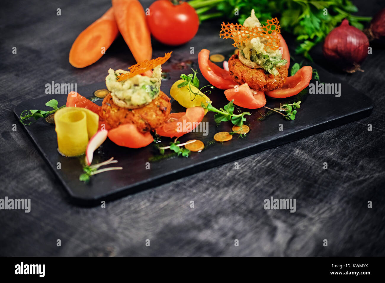 Seafood snacks with tomatoes Stock Photo - Alamy
