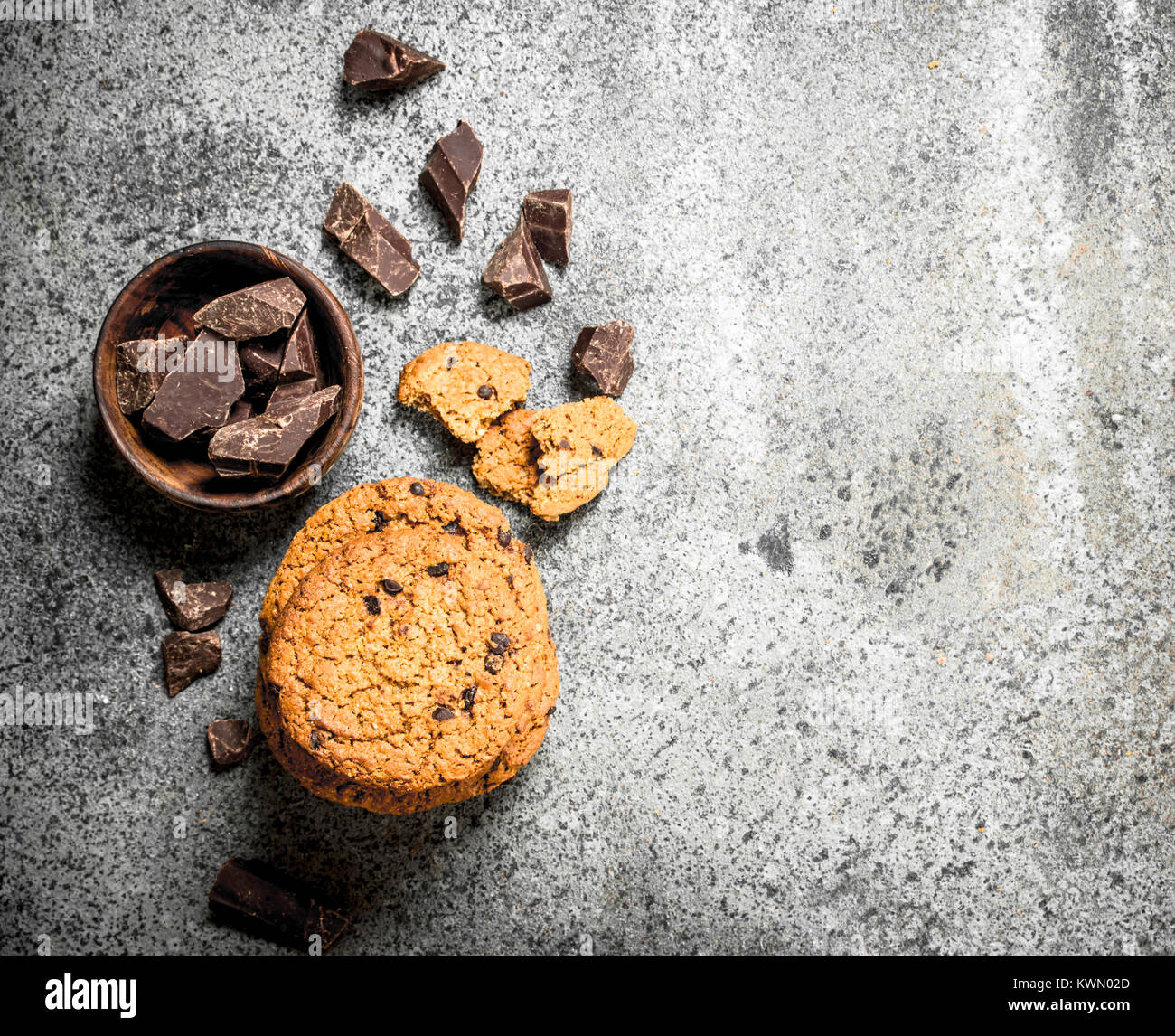Oatmeal cookies with chocolate in a bowl. On a rustic background Stock ...