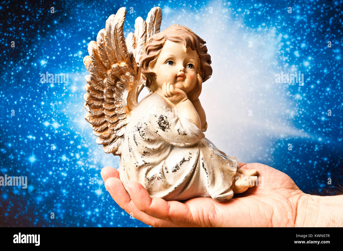 angel statue with divine light Stock Photo - Alamy