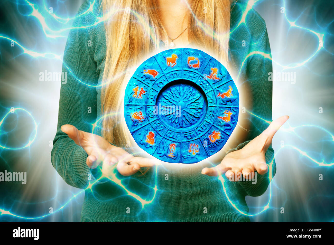 woman with open hands holding a zodiac plate with astrology signs Stock ...