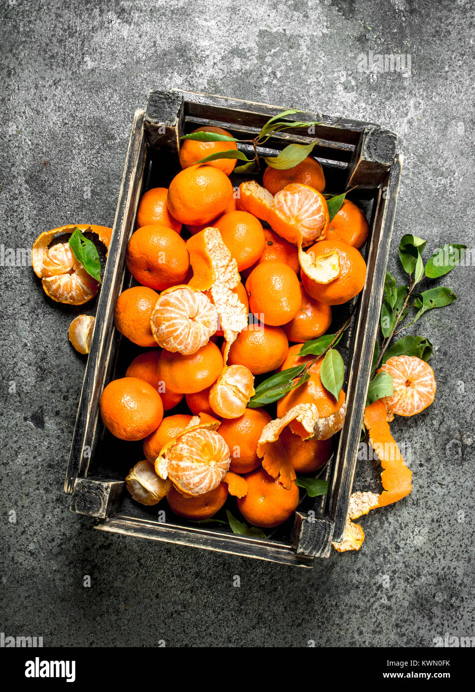 Fresh mandarins in an old box. On a rustic background Stock Photo - Alamy
