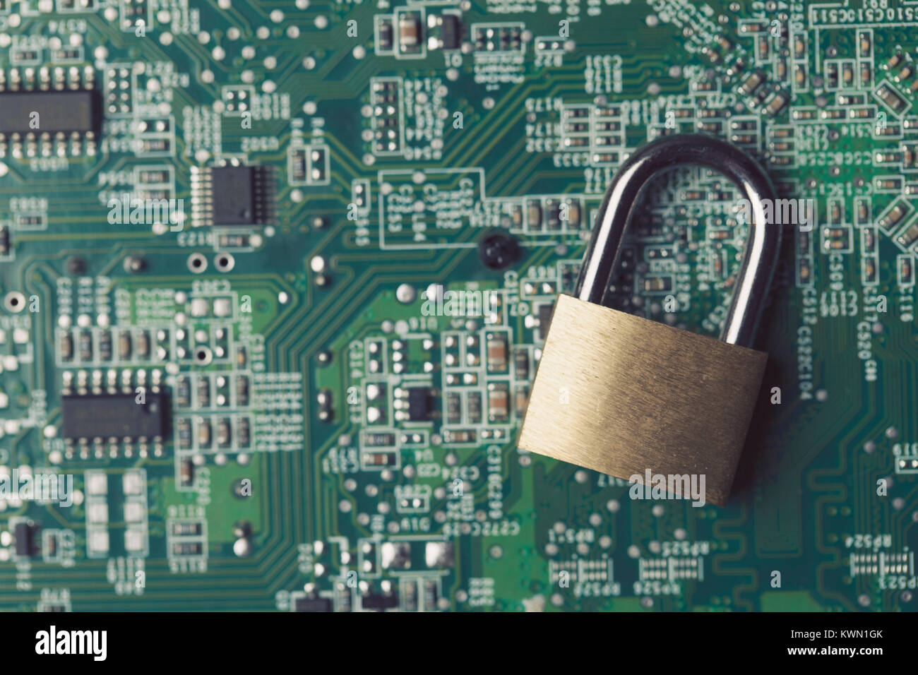 Padlock on a computer electronic circuit board. Technology security ...