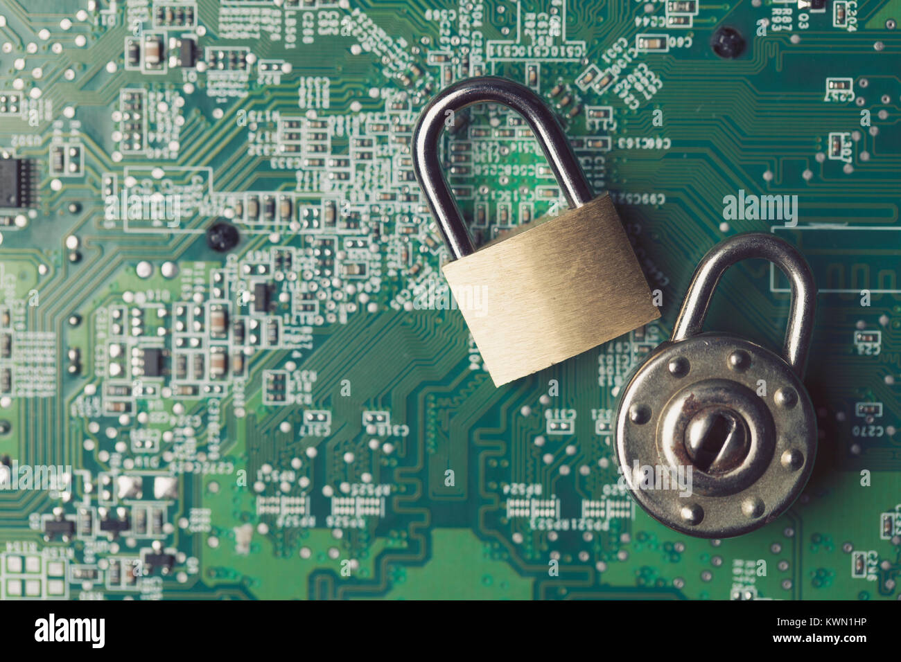 Padlock on a computer electronic circuit board. Technology security ...