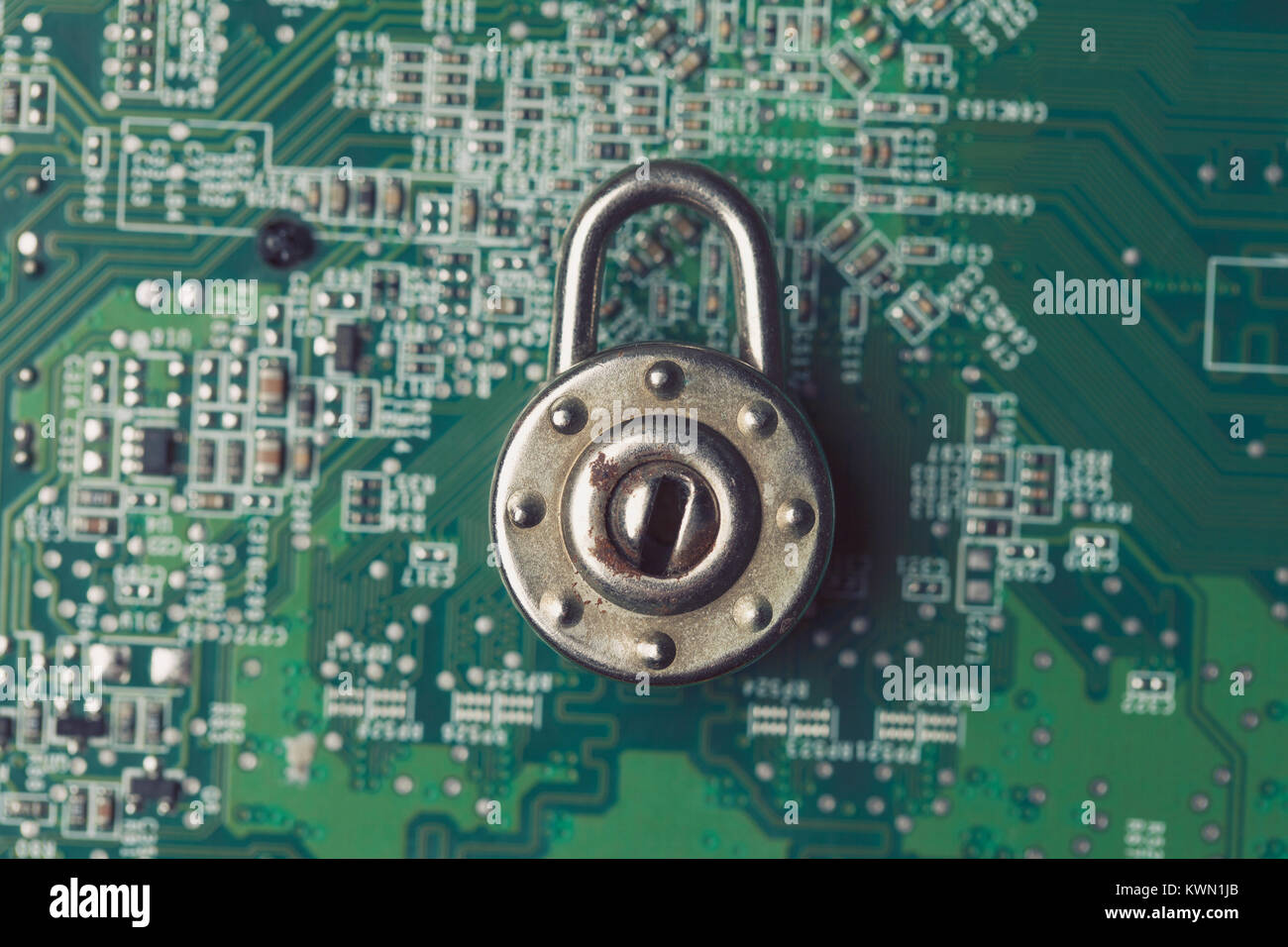 Padlock on a computer electronic circuit board. Technology security ...