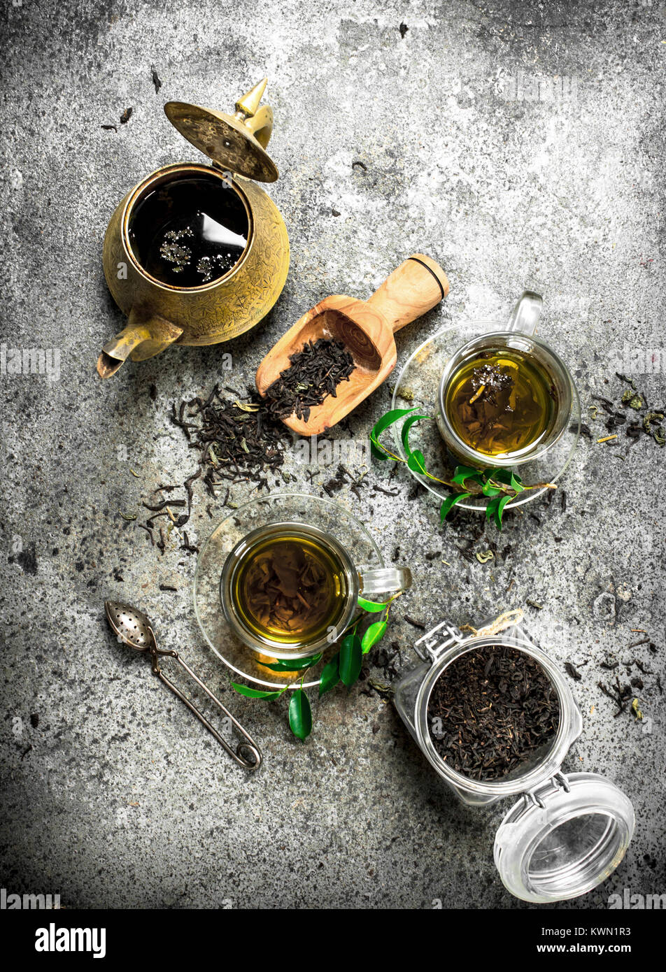 Fresh Indian tea with a brewer. On a rustic background Stock Photo - Alamy