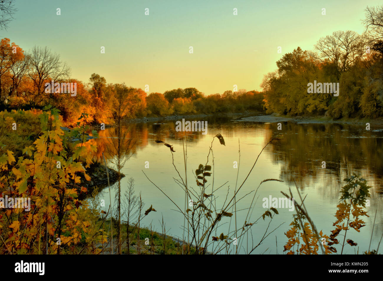 Sunset along River in fall Stock Photo - Alamy