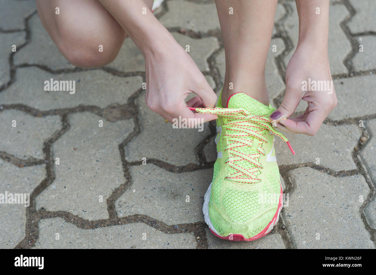 Runner woman feet running on road closeup on shoe. Female fitness ...