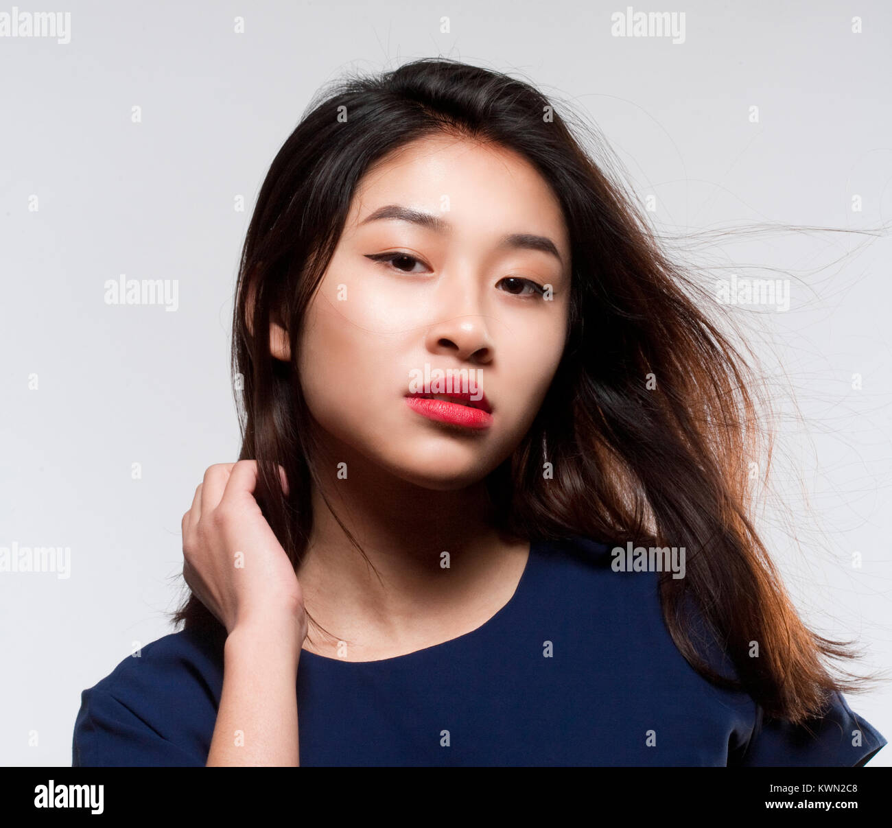 Studio Portrait of a Teenage Girl in Blue Top Stock Photo - Alamy