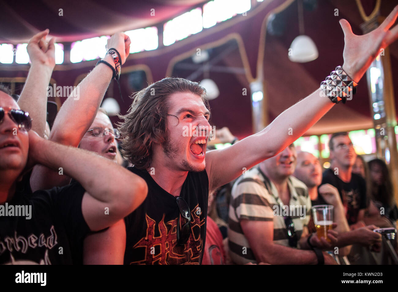 Enthusiastic hard rock and heavy metal music fans have a great time at ...