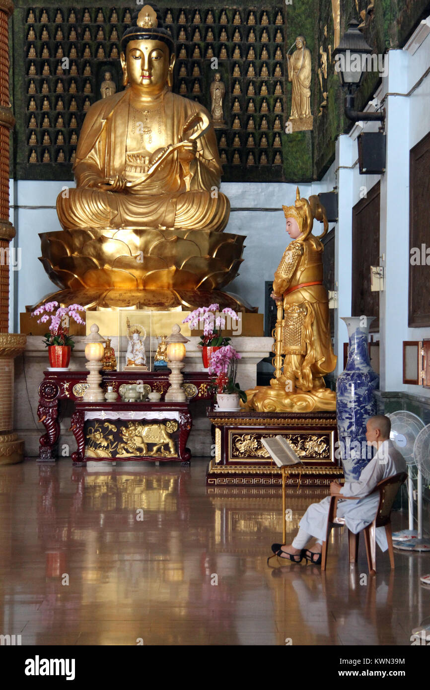 Golden statue Buddha and monk inside buddhist temple in Kaohsiung ...