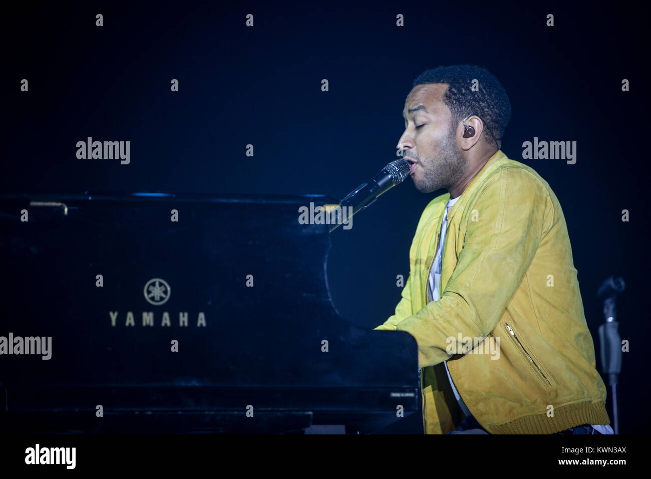 R&B singer and musician John Legend pictured behind his piano at a live ...