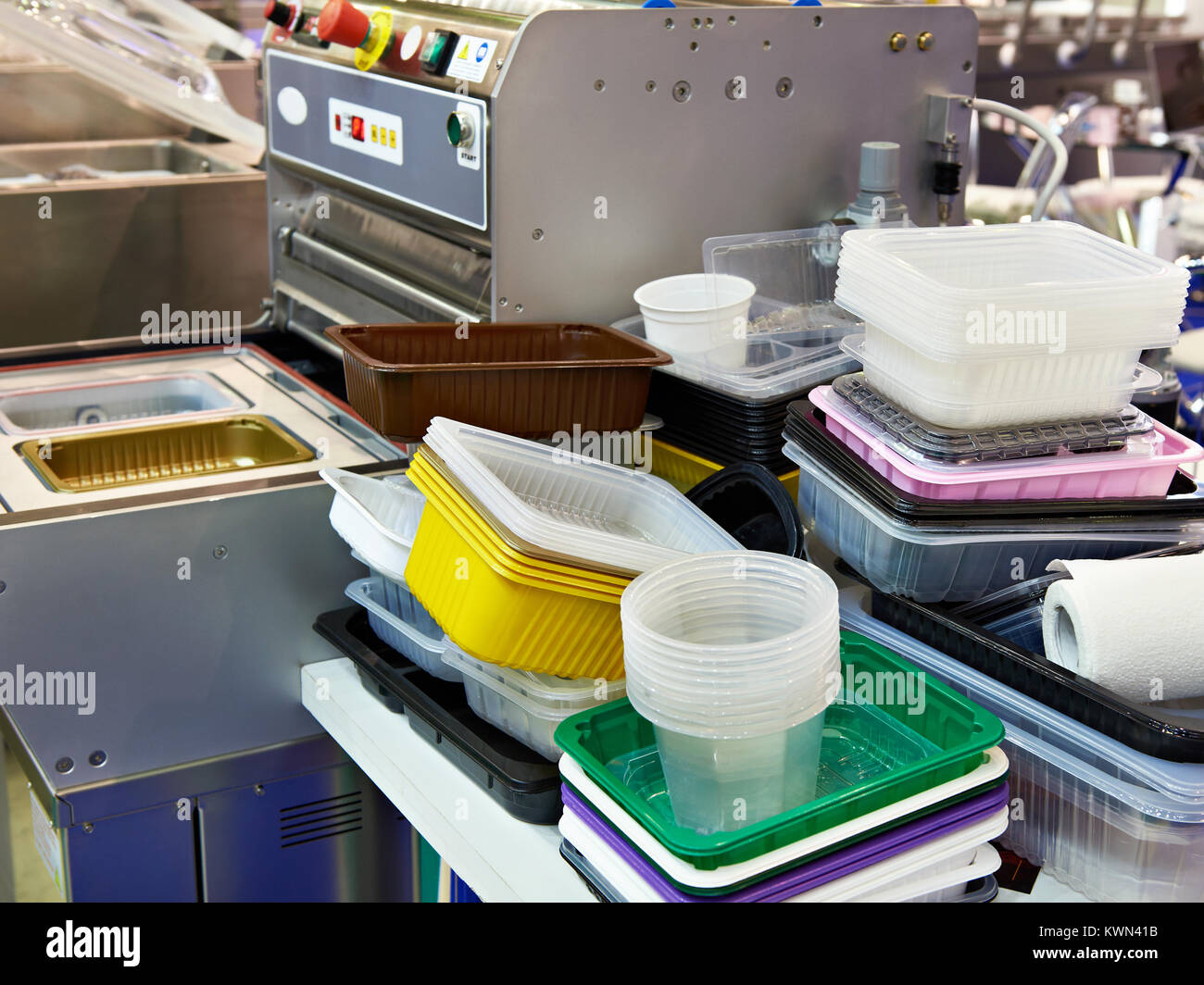 Different plastic containers in the food factory Stock Photo - Alamy