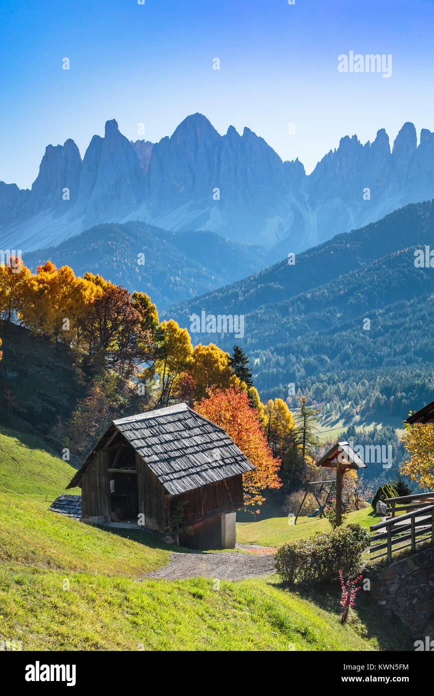 The Dolomite moutain range with fall foliage color near San Pietro, Val ...