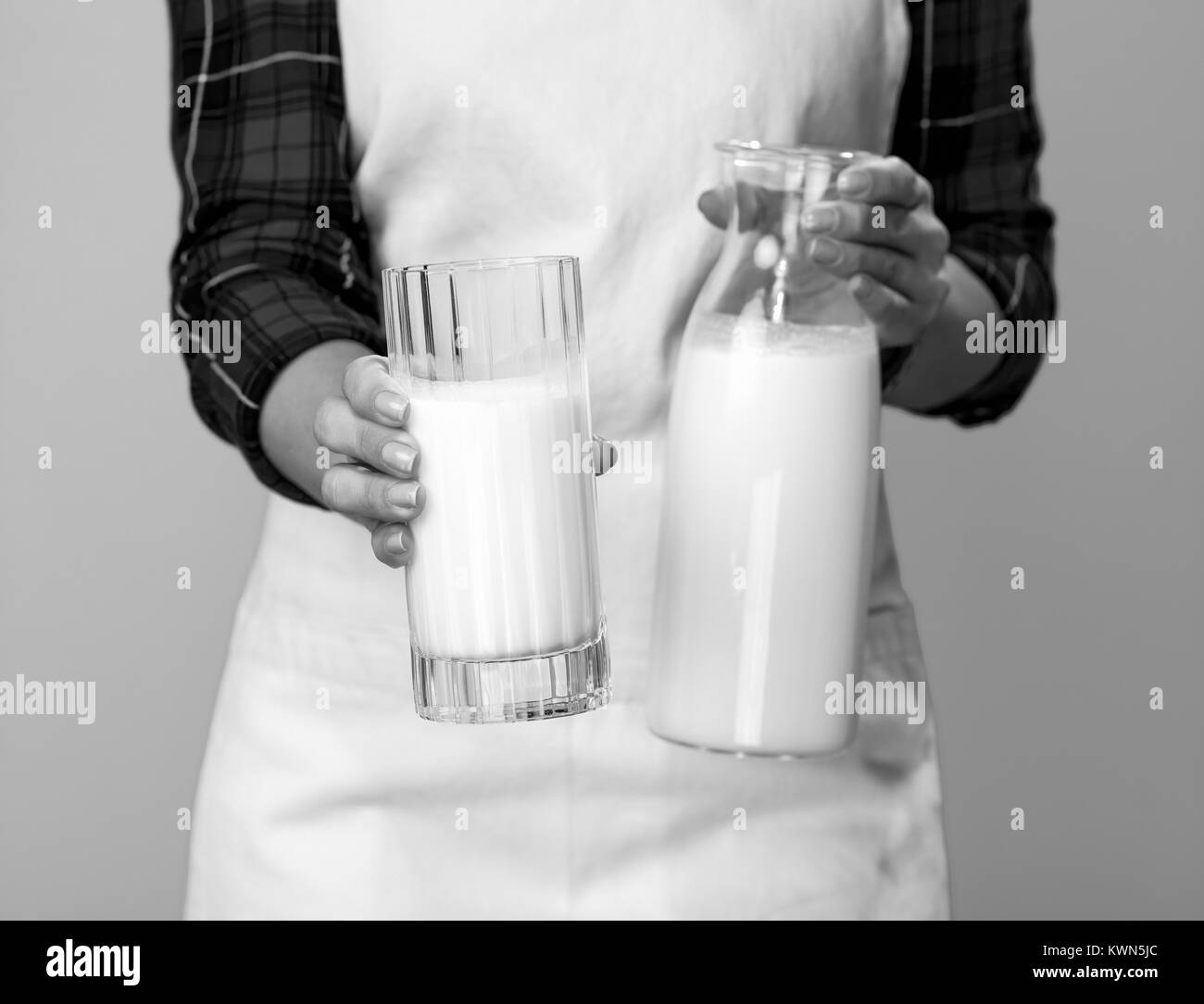 Healthy food to your table. Closeup on young woman farmer wearing apron ...
