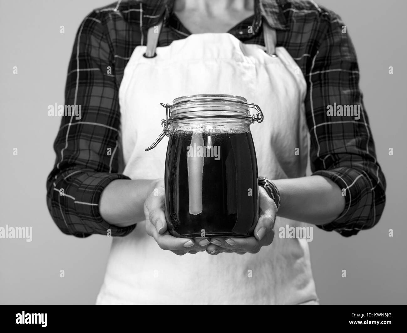 Healthy food to your table. Closeup on modern woman cook wearing apron ...