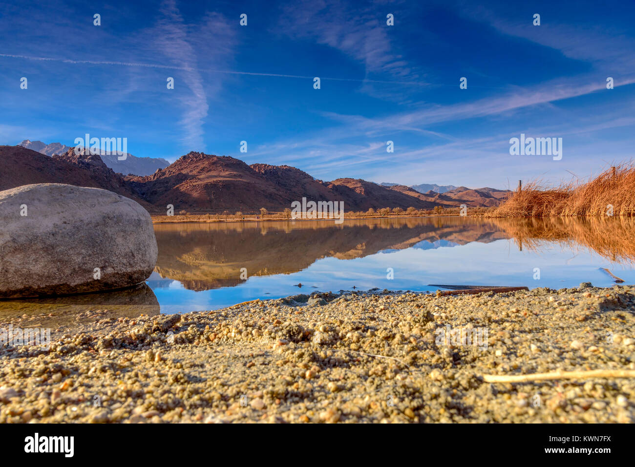 Bolder in Lake Stock Photo - Alamy